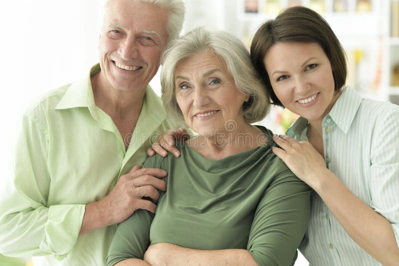 Happy Senior Parents with Daughter at Home Stock Image - Image of ...