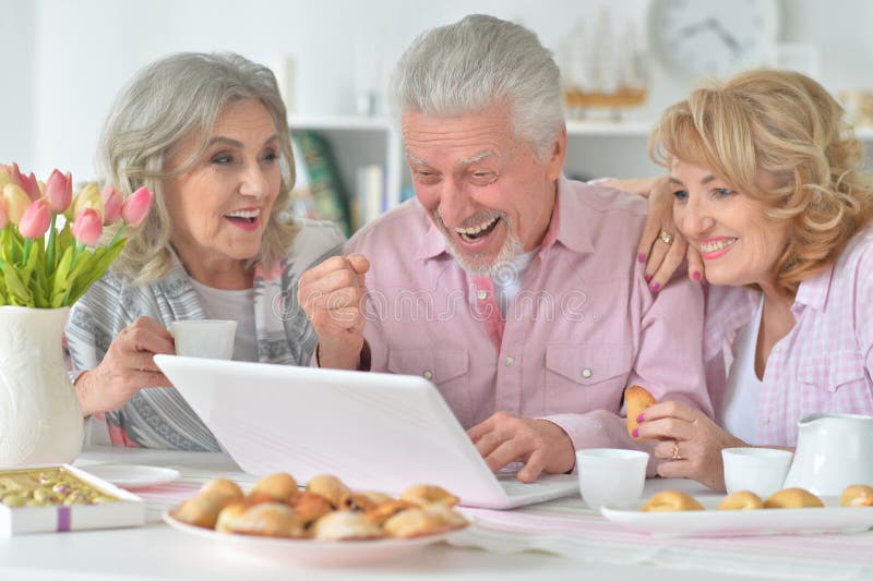 Portrait of Happy Senior People with Laptop Drinking Tea Stock Image ...