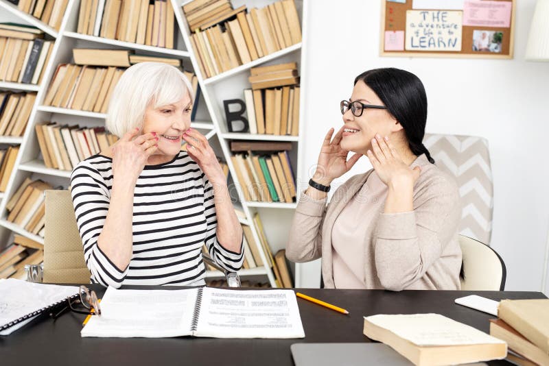 Happy Senior Tutor Showing Right Pronunciation Stock Image - Image of ...