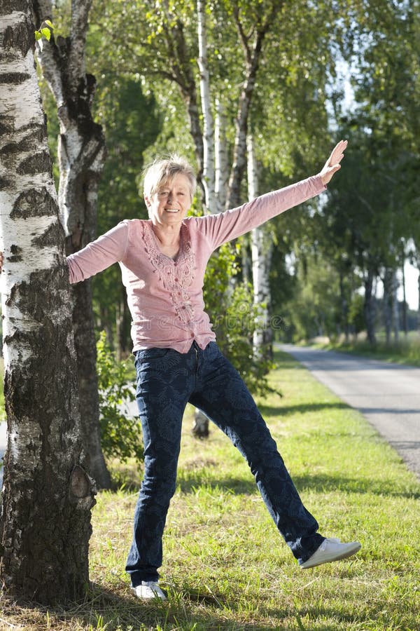 Happy Senior Woman Active in Nature Stock Image - Image of outstretched ...