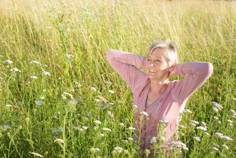 Happy Senior Woman Active in Nature Stock Photo - Image of nature, arms ...