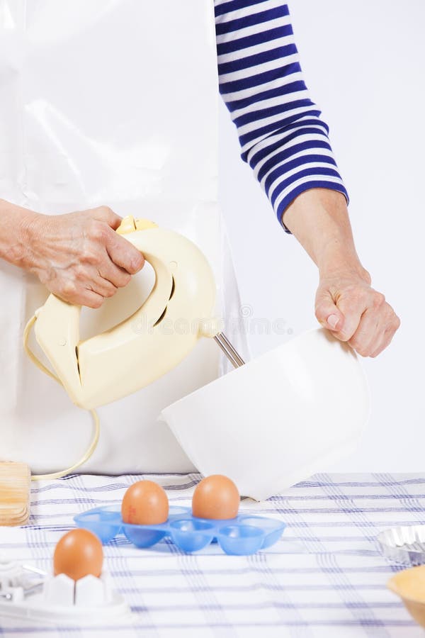 Senior woman cooking stock image. Image of cooking, active - 21898889