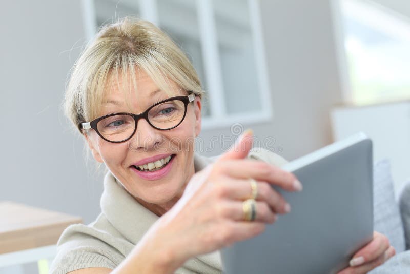 Happy Senior Woman Using Tablet Stock Photo - Image of digital ...