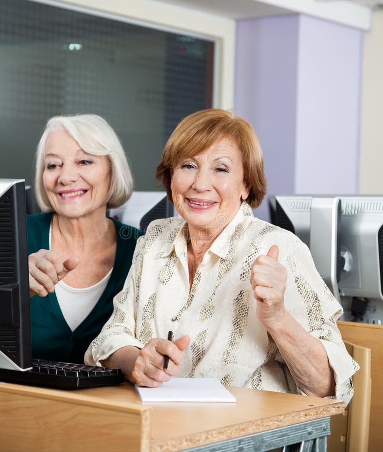 Happy Senior Women at Computer Desk in Classroom Stock Image - Image of ...