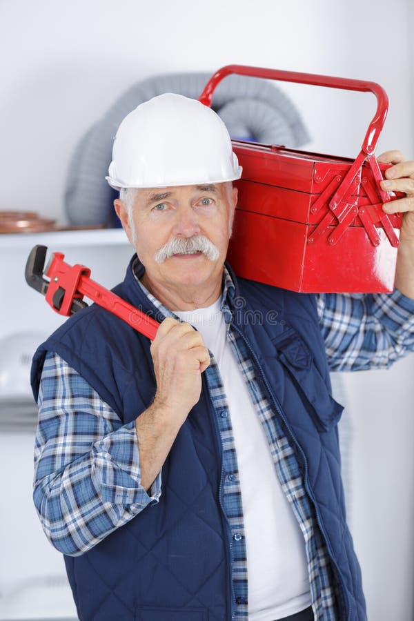 Happy Senior Worker Holding Toolbox and Wrench Stock Image - Image of ...