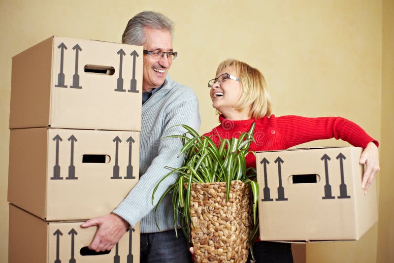 Happy seniors moving stock image. Image of apartment - 18353527