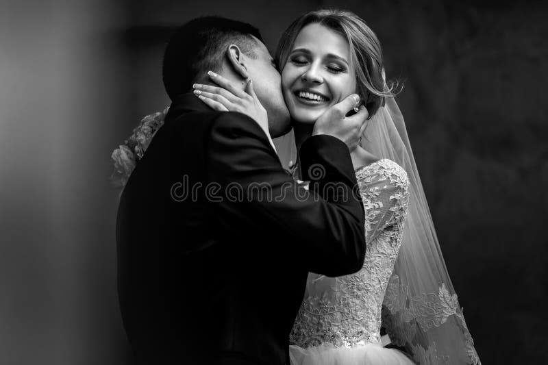 Happy Sensual Handsome Groom And Blonde Beautiful Bride In White Stock