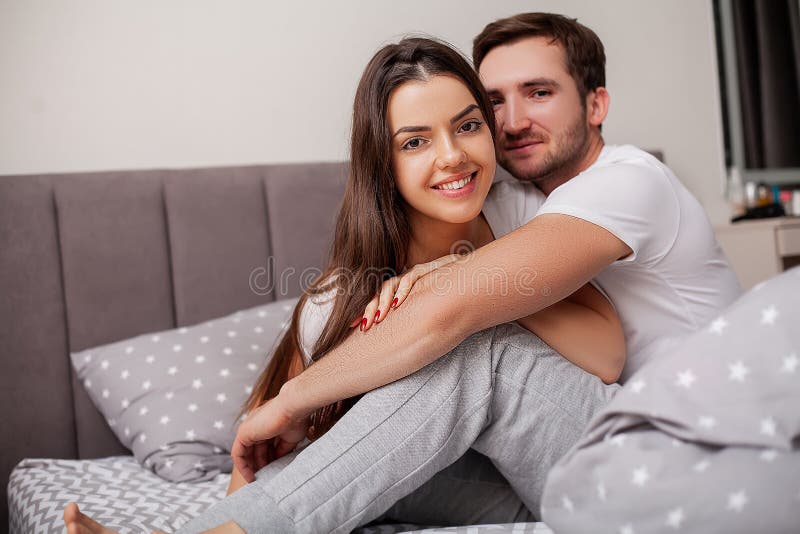 Happy Sensual Young Couple Lying in Bed Together Stock Image - Image of ...