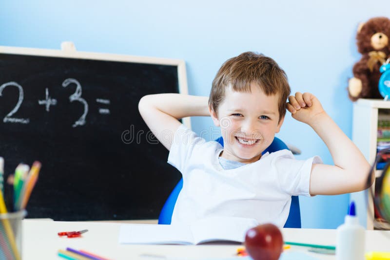 Happy Seven Years Old Boy in Classroom Stock Image - Image of positive ...