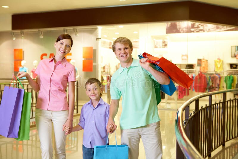 Happy shoppers stock photo. Image of male, cute, female - 15882404