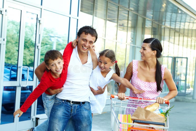 Happy shoppers stock photo. Image of parenthood, excitement - 24309462