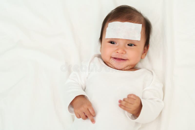 Sick Crying Baby with Cool Fever Pad on Forehead Stock Photo - Image of ...