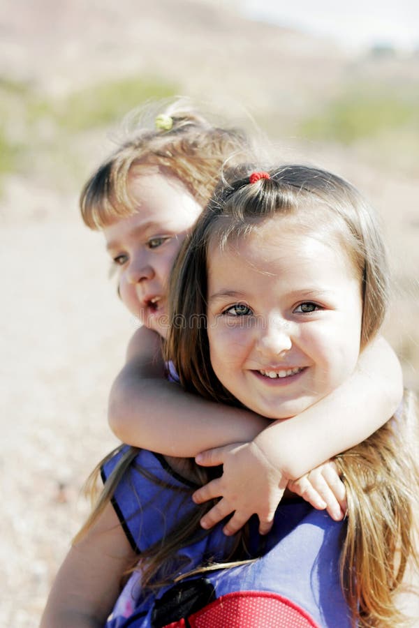 Happy Sisters & A Piggyback Ride Stock Image - Image of carrying ...