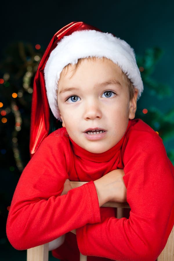 Happy Small Boy in Santa Hat Stock Photo - Image of green, happiness ...