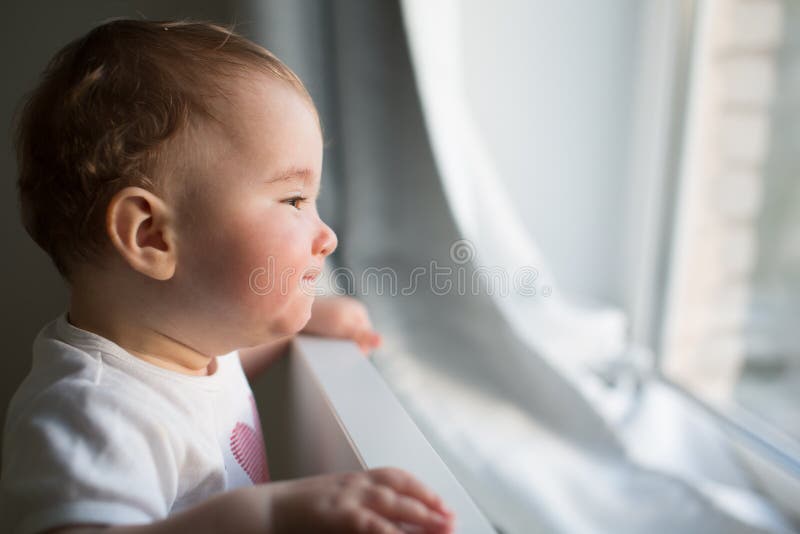 Happy and Small Child Near the Window Stock Image - Image of light ...