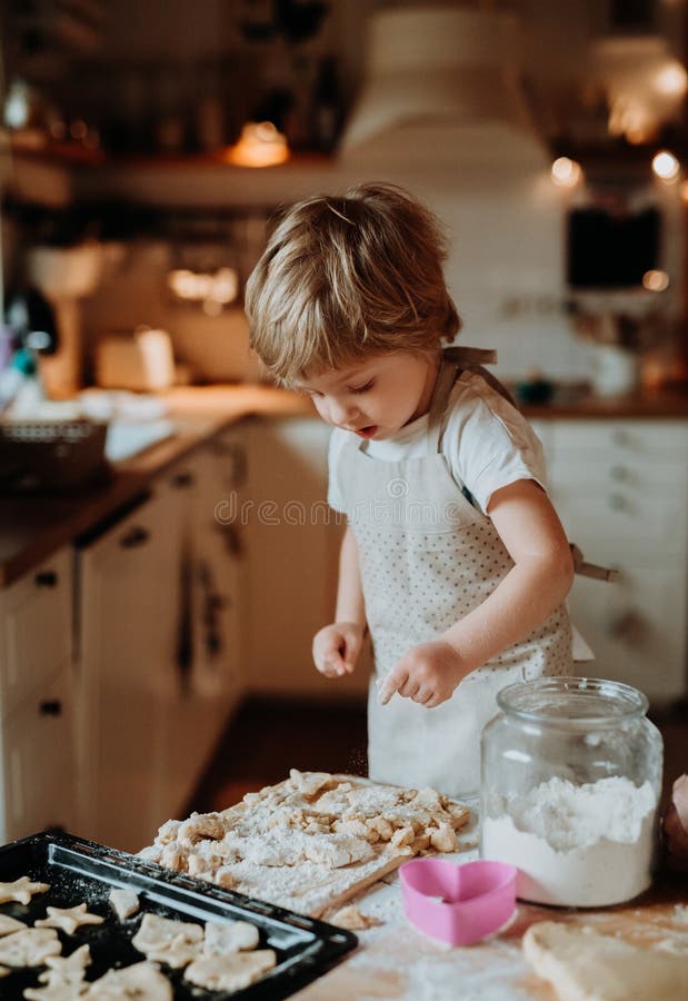 A Happy Small Toddler Boy Making Cakes at Home. Stock Image - Image of ...