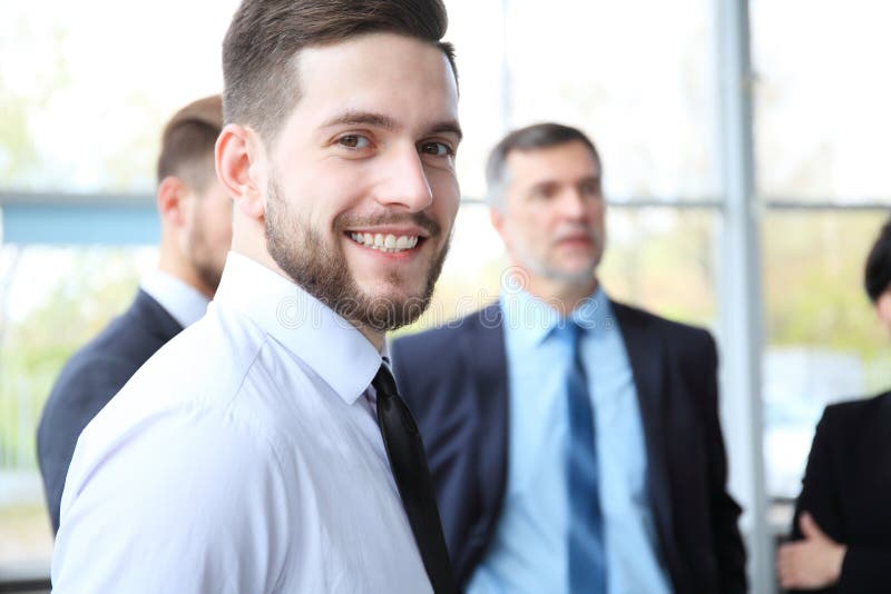 Happy Smart Business Man with Team Mates Discussing in the Background ...