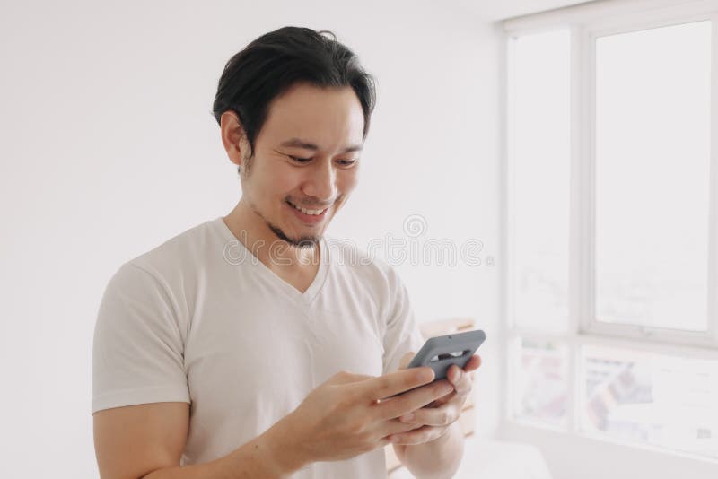 Happy and Smile Face of Man Using Smartphone. Stock Image - Image of ...
