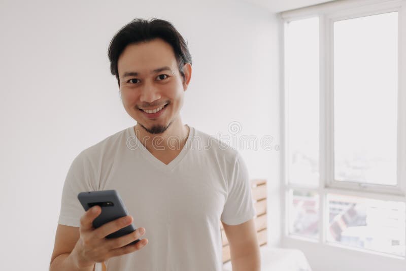 Happy and Smile Face of Man Using Smartphone. Stock Image - Image of ...