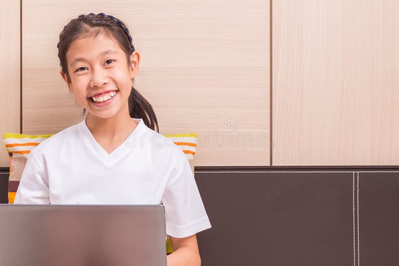 Happy Smiling Asian Girl Using Notebook Computer To Study on Her Stock ...