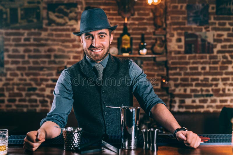 Happy and Smiling Bartender Preparing Cocktails and Enjoying Working at ...