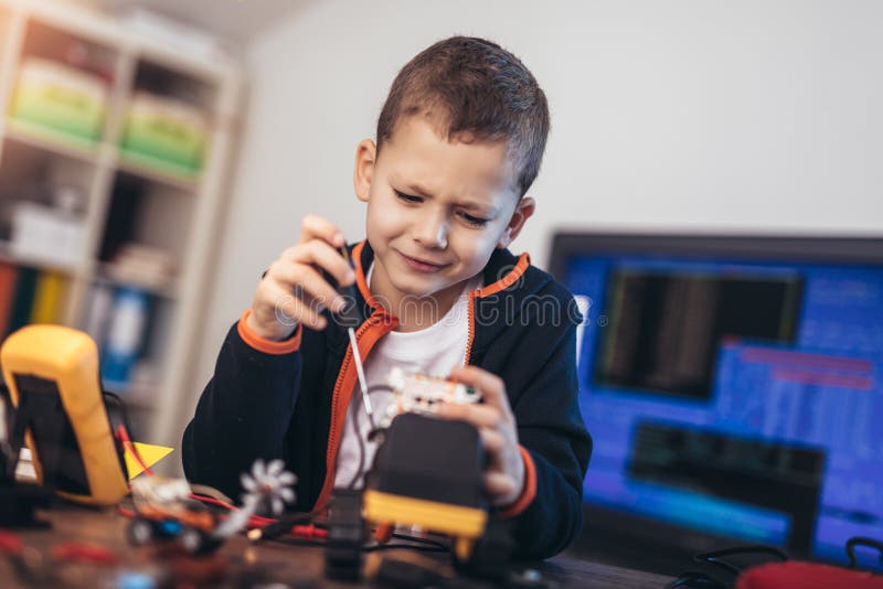Happy Smiling Boy Constructs Technical Toy. Stock Image - Image of idea ...