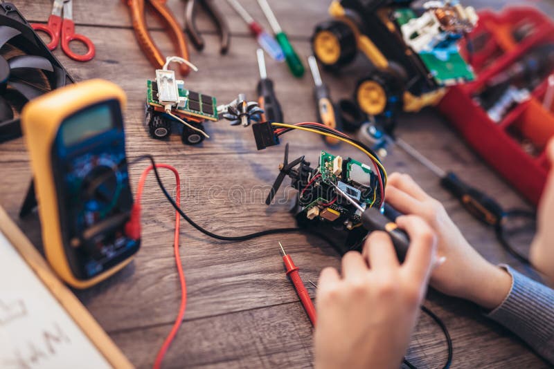 Boy and Girl Constructs Technical Toy and Make Robot. Technical Toy on ...