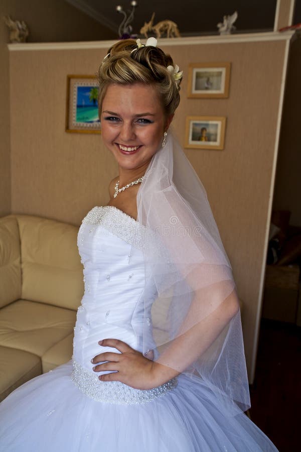 Smiling Bride Setting the Garter Stock Photo - Image of fianc ...