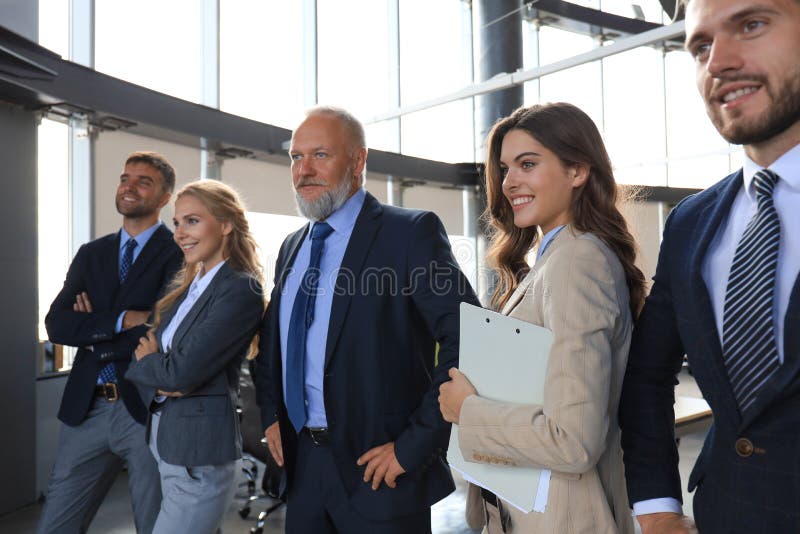 Happy Smiling Business Team Standing in a Row at Office Stock Image ...