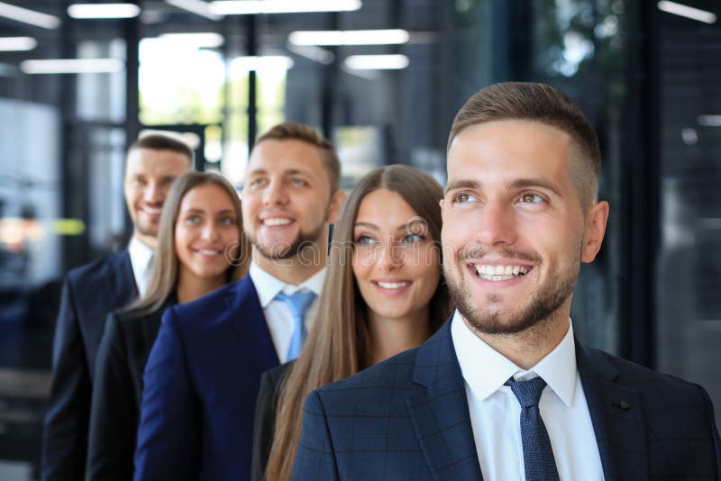 Happy Smiling Business Team Standing in a Row at Office Stock Image ...