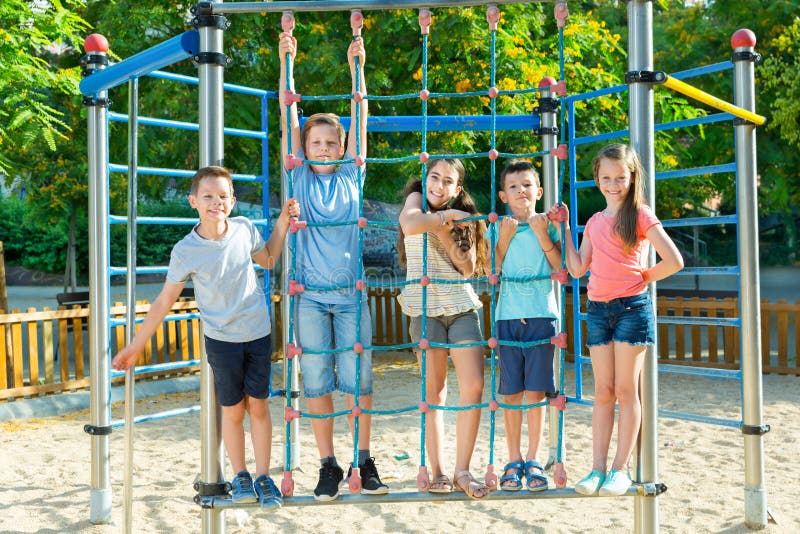 Happy Children Playing at Playground Stock Photo - Image of community ... Happy Children Playing at Playground Stock Photo - Image of community ...