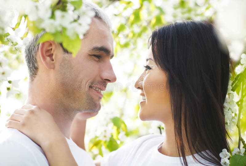 Happy Smiling Couple in Love in Spring Garden Stock Photo - Image of ...