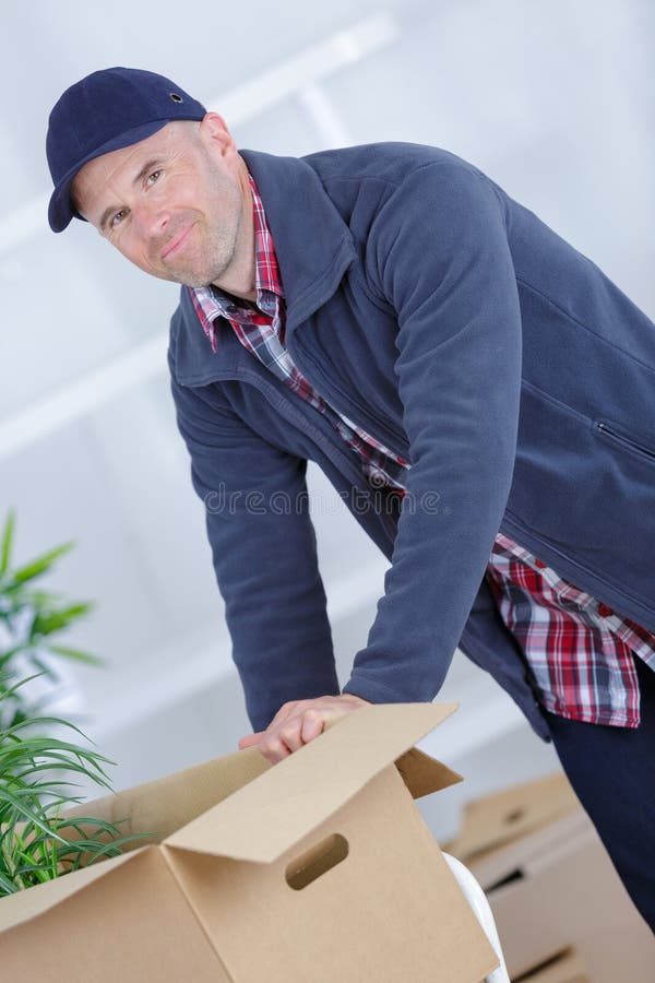 Happy Smiling Delivery Man Carrying Boxes Stock Image - Image of ...