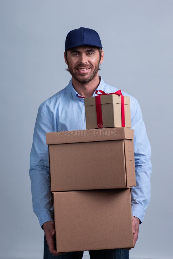 Delivery man with boxes stock image. Image of deliver - 164821857