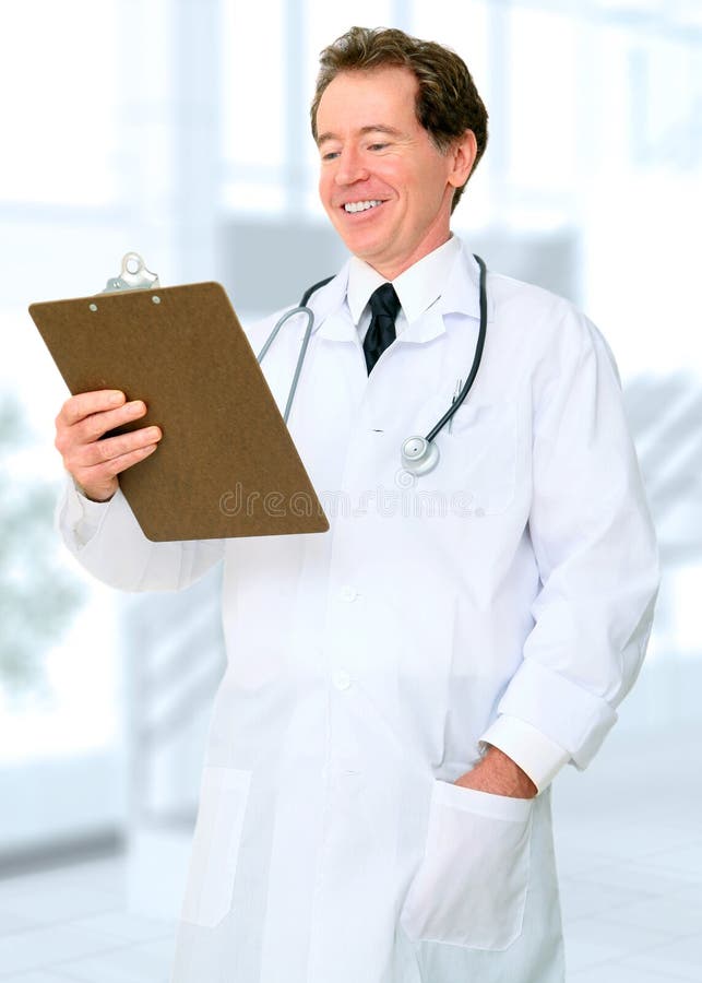 Happy Smiling Doctor Reading Report in His Office Stock Image - Image ...
