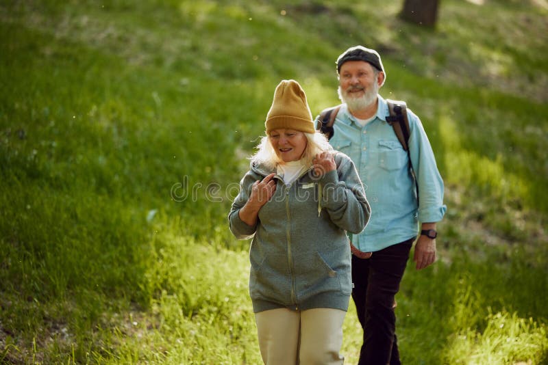 Happy Smiling Elderly Couple Man And Woman Holding Hands Walk