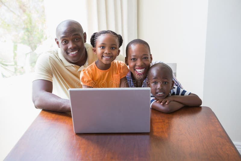 Happy Smiling Family Using Laptop Stock Photo - Image of casual ...