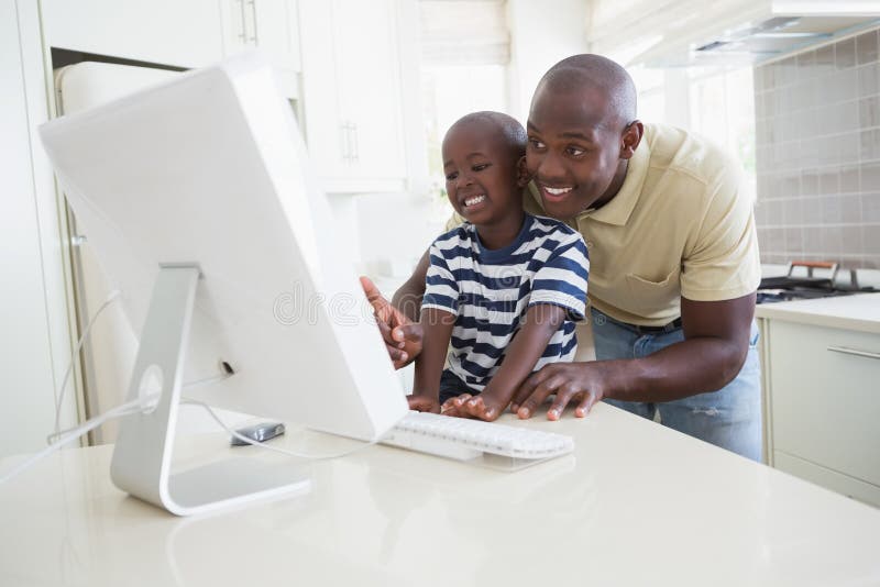 Happy Smiling Father with His Son Using Computer Stock Photo - Image of ...