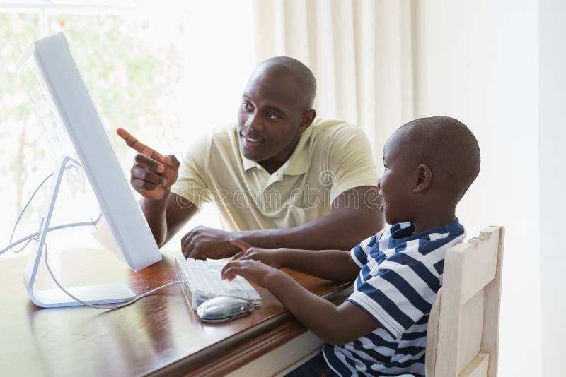 Happy Smiling Father with His Son Using Computer Stock Photo - Image of ...