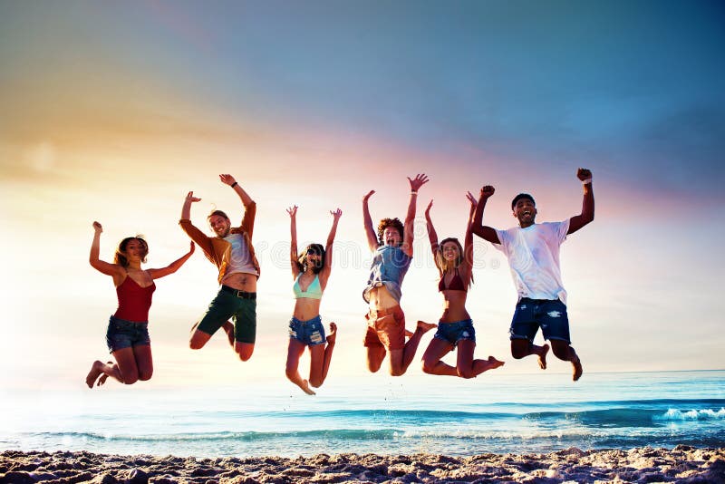 Happy Smiling Friends Jumping at the Beach Stock Photo - Image of ...