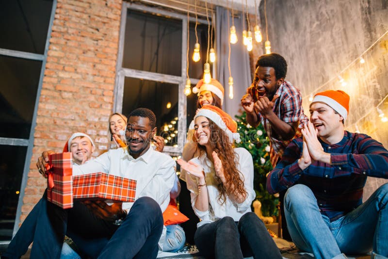 Happy Smiling Friends Opening Magic Christmas Gift Stock Image - Image ...