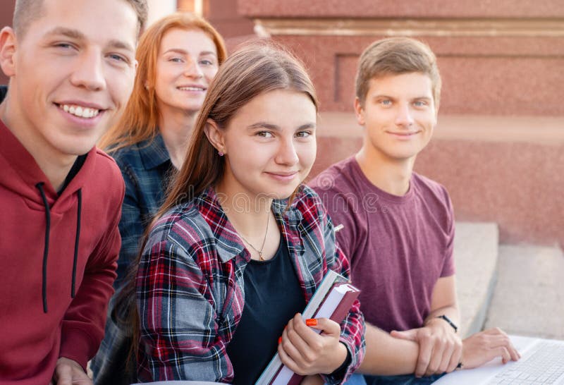 Happy Smiling Group of Students Studying Outdoors Near University Stock ...