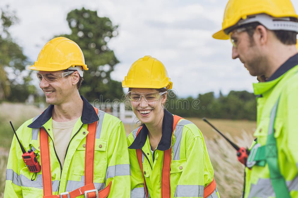 Happy Smiling and Laughing Engineer Team Workers Talking Together Relax ...