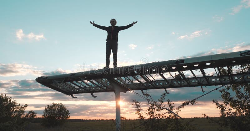 Happy Smiling Man with a Beard is Standing on the Wing of an Abandoned ...