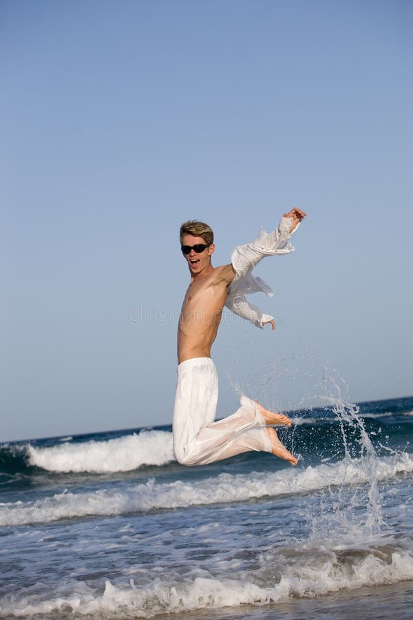 Happy Smiling Man Jumping on Beach Stock Image - Image of success ...