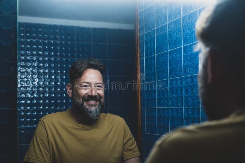 Happy Smiling Man Looking at the Mirror Stock Photo - Image of ...