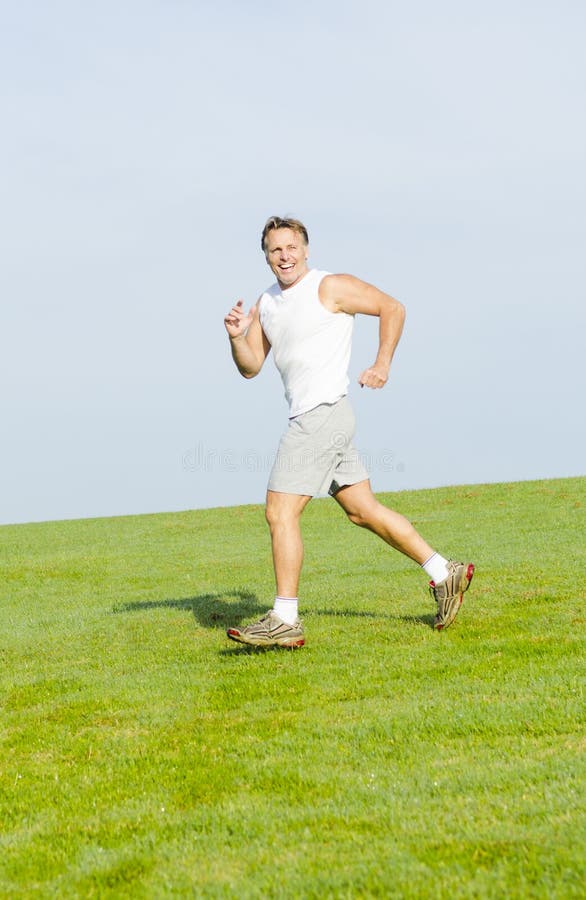 Happy smiling man running. stock image. Image of person - 25700233