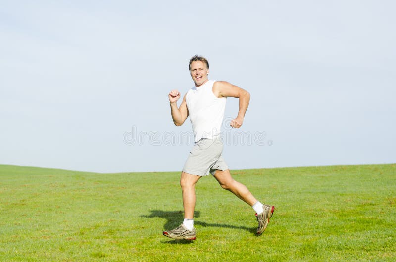 Happy smiling man running. stock image. Image of running - 25700243