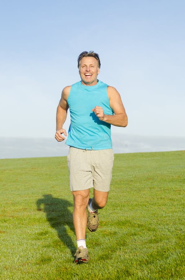 Happy smiling man running. stock photo. Image of handsome - 25770246