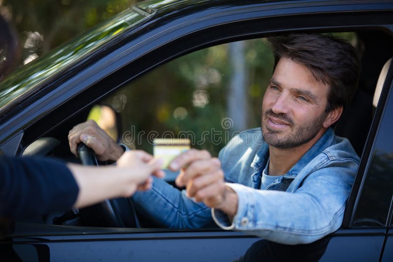 Happy Smiling Man Sitting in Car Showing Credit Card Stock Photo ... Happy Smiling Man Sitting in Car Showing Credit Card Stock Photo ...